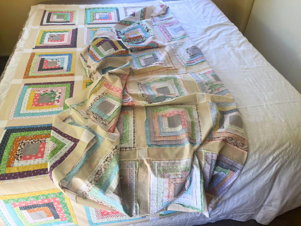 How to Sandwich A Quilt Step-by-Step Tutorial - Sew Nikki