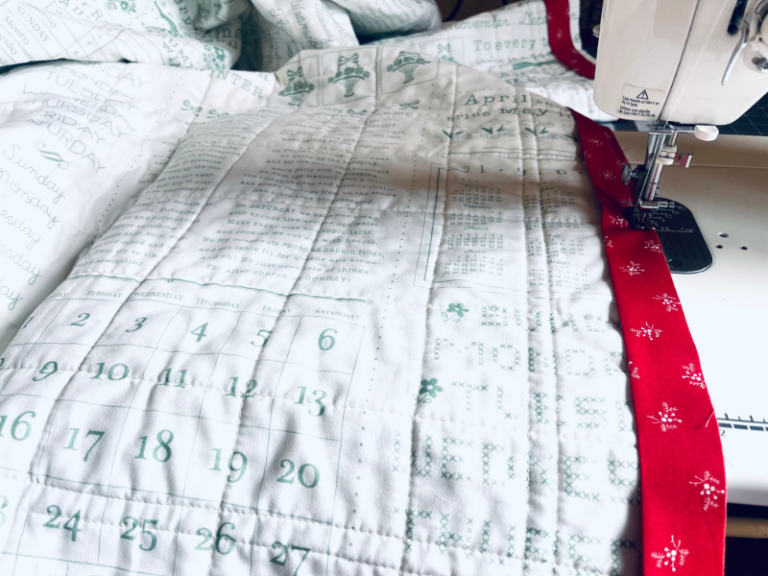 How To Sew Binding on a Quilt - Sew Nikki